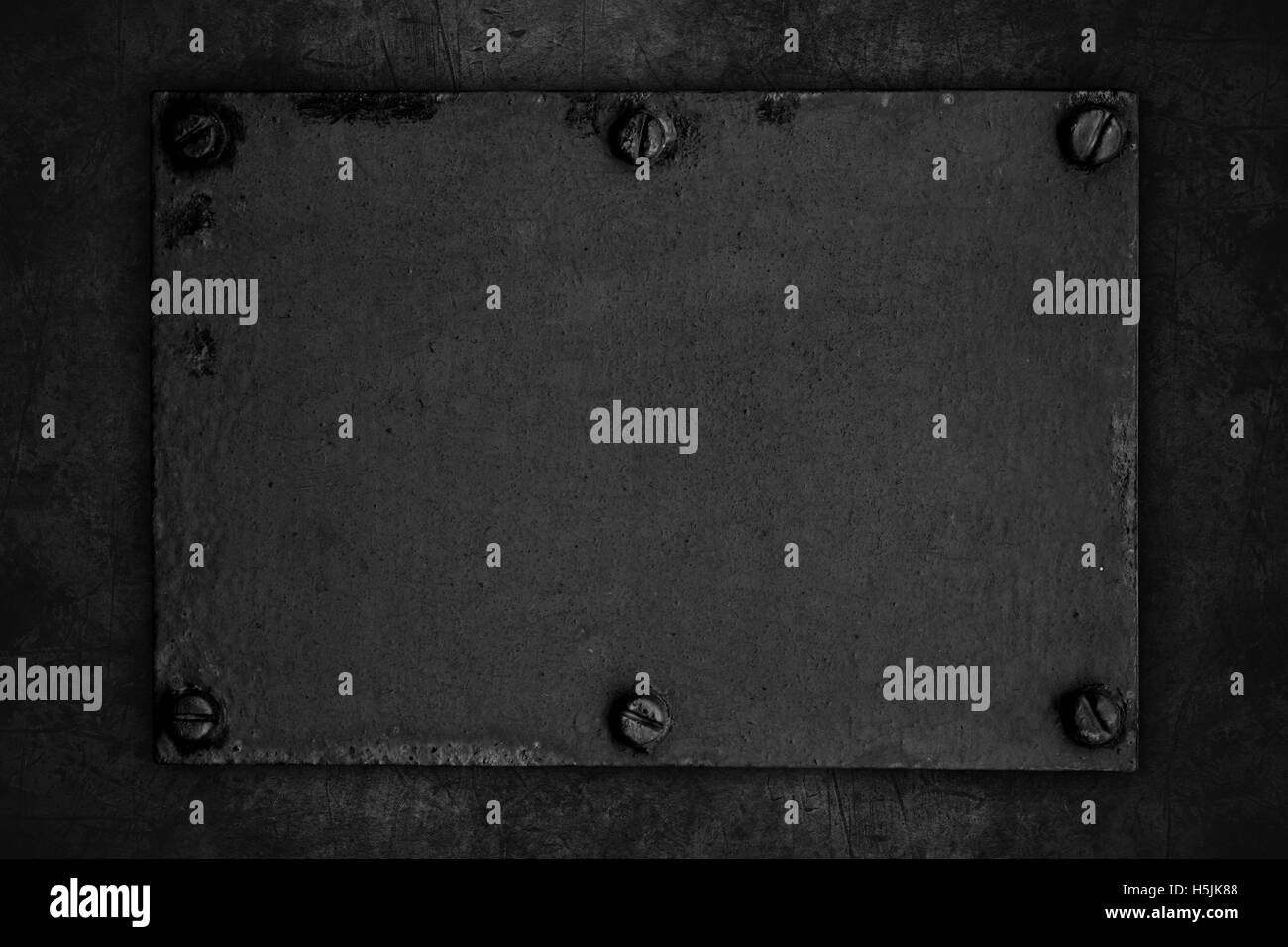 black steel plate with screws or abstract metal background Stock Photo ...