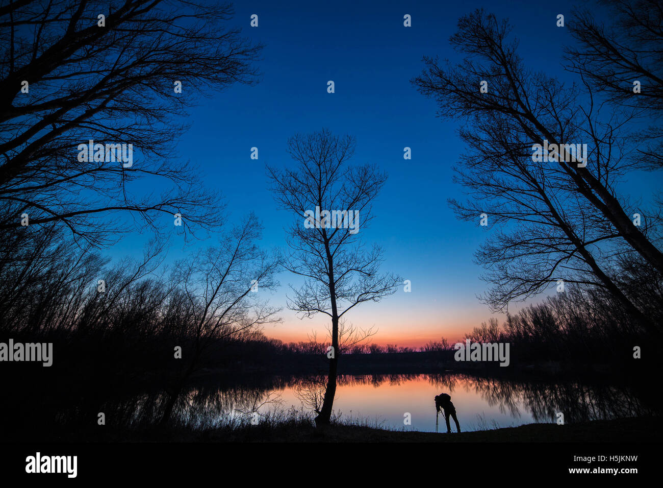 Night lake scene with photographer Stock Photo - Alamy