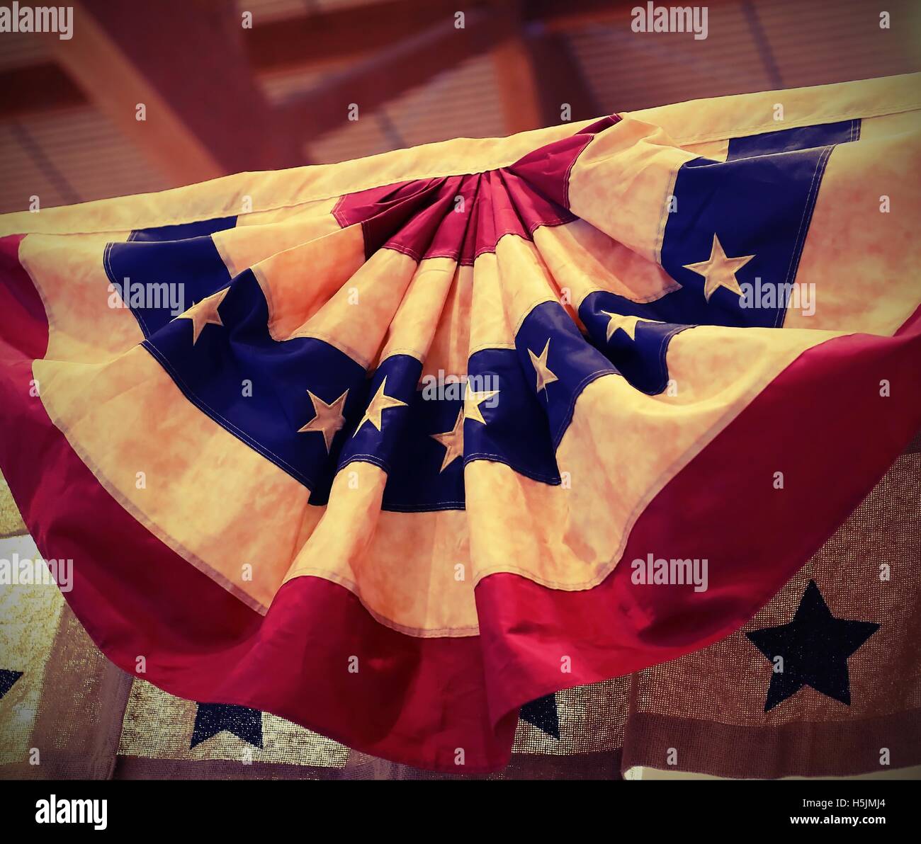 Old American flag in the circular tissue hanging on the ranch Stock ...