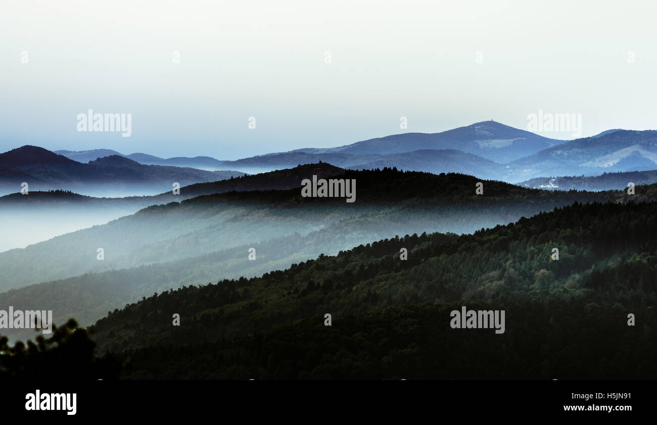Beautiful mountains landscape from the top of the hill with fog, Alsace ...