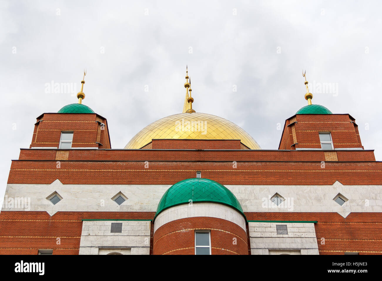 Muslim temple with green and gold domes Stock Photo - Alamy