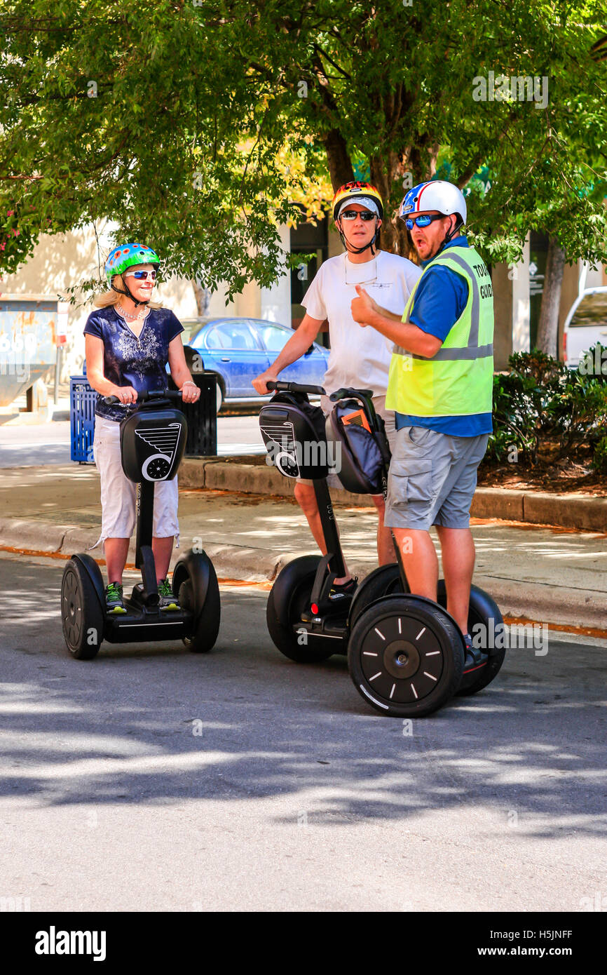 Two people on a guided segway tour around Asheville NC Stock Photo - Alamy