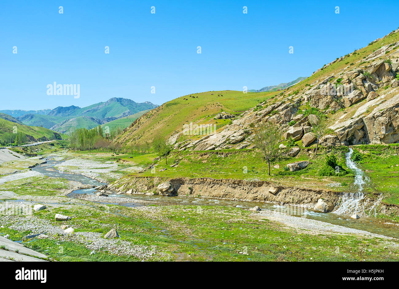 The amazing view on the rocky slopes and narrow mountain river in ...