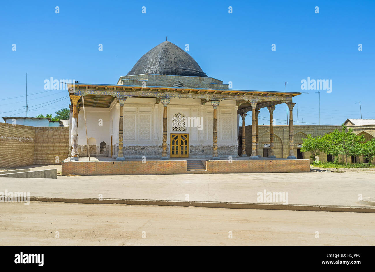 The white mosque, decorated with the carved wooden pillars of its ...