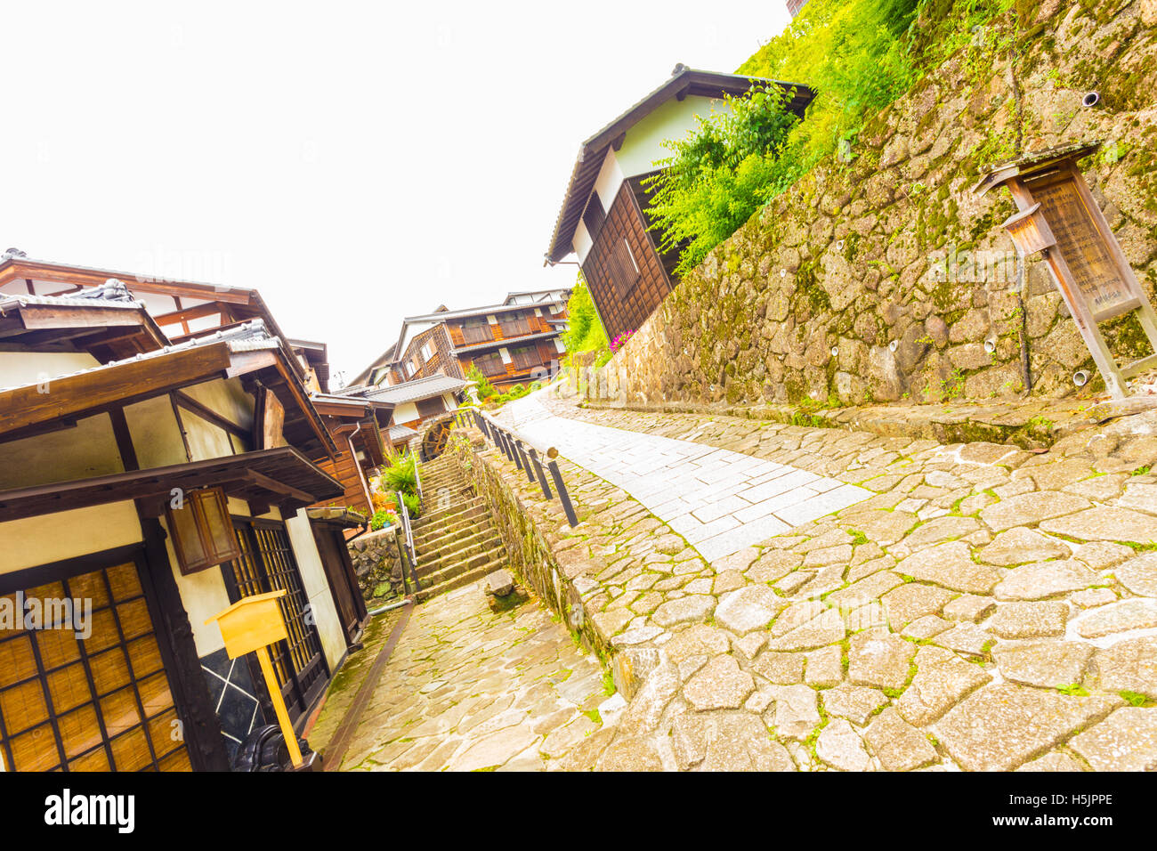 Stone path southern entrance to historic Magome station post town along ...
