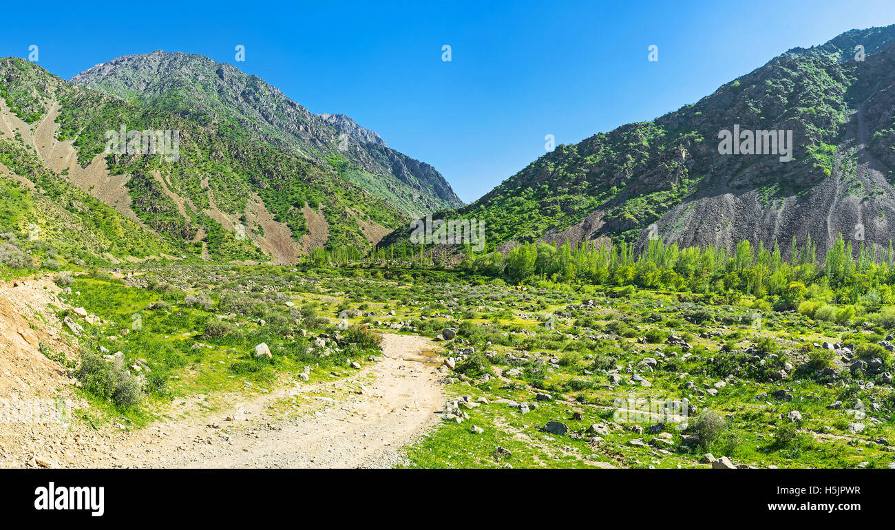 The dusty path leads to the winding Zarmas gorge in Gissar Range of ...
