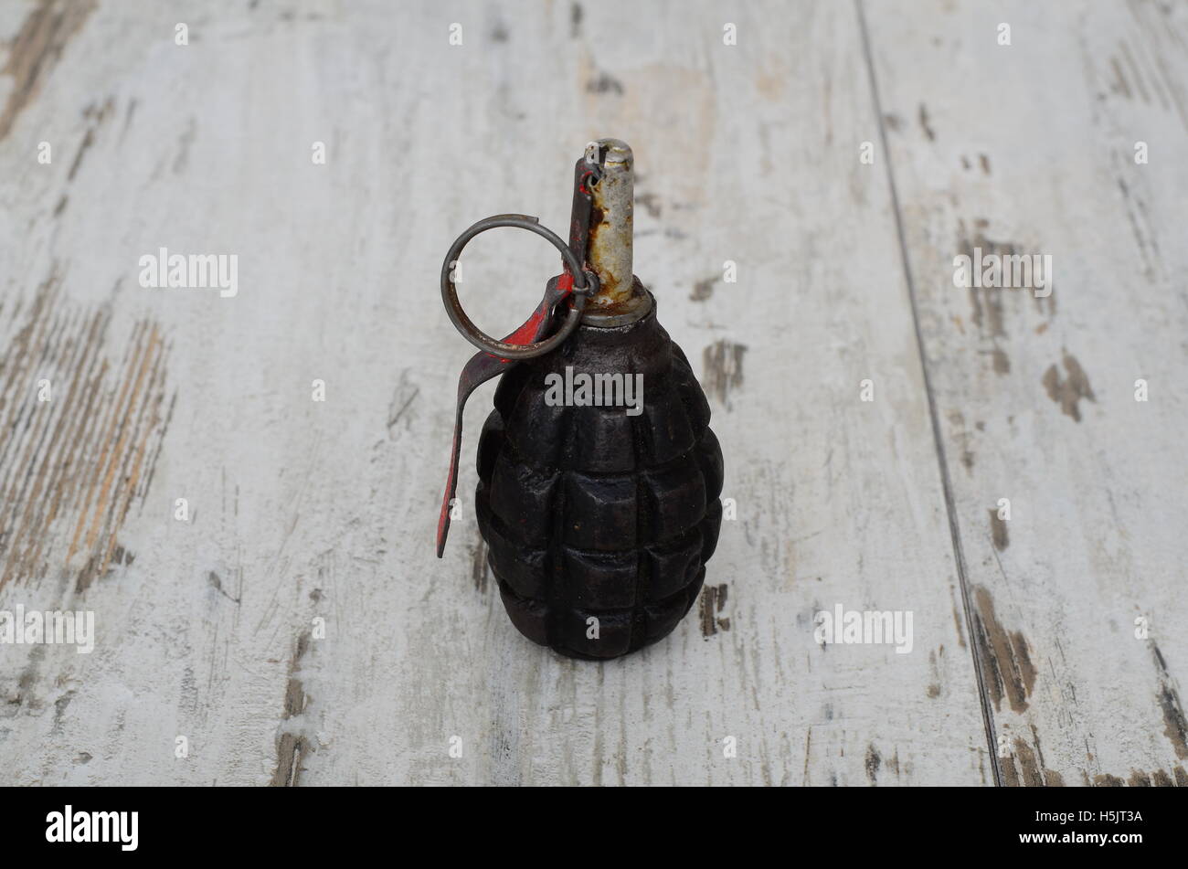 Old Hand Grenade on wood background. disguise, alarm Stock Photo - Alamy