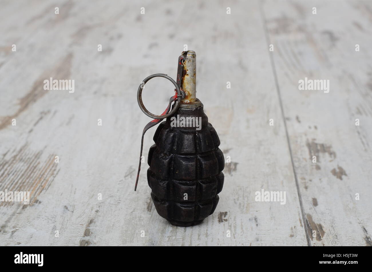 Old Hand Grenade on wood background. disguise, alarm Stock Photo - Alamy