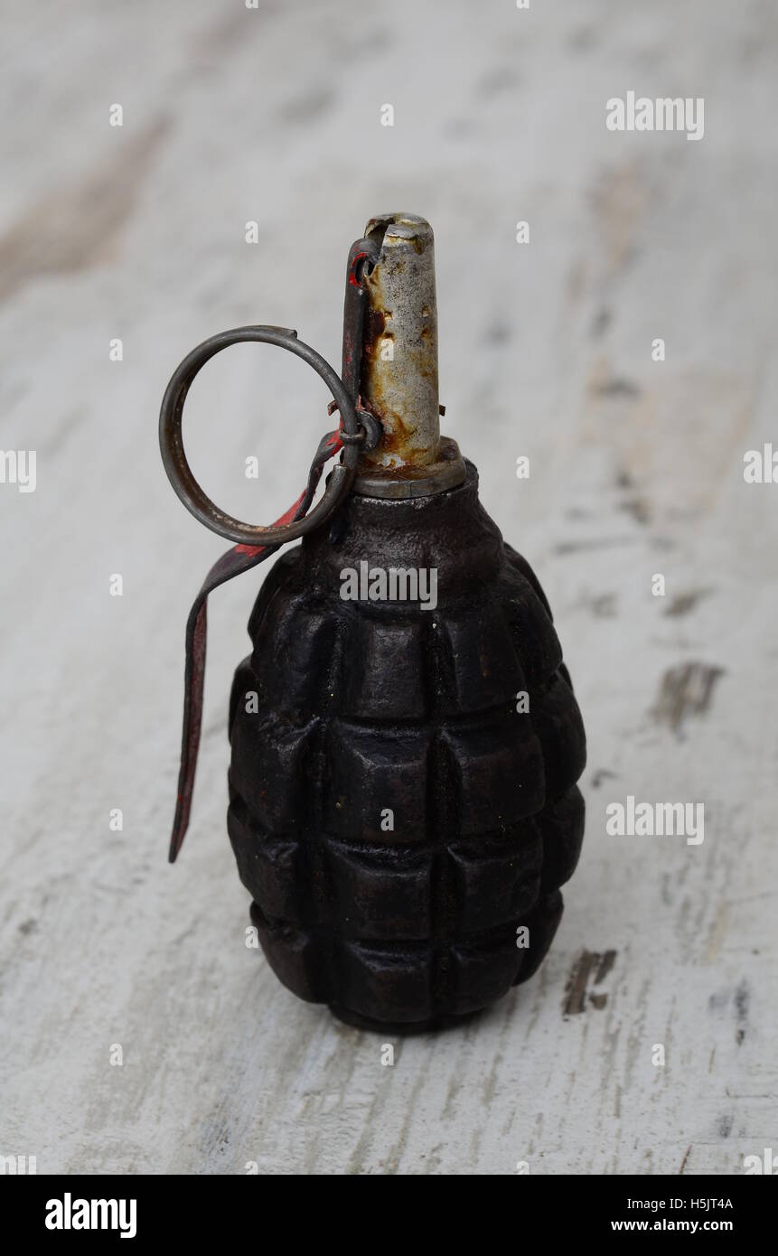 Old Hand Grenade on wood background. disguise, alarm Stock Photo - Alamy