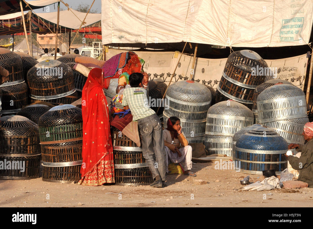 Naguar, Rajasthan, India- Febuary 10, 2011: A Rajasthani family selling ...