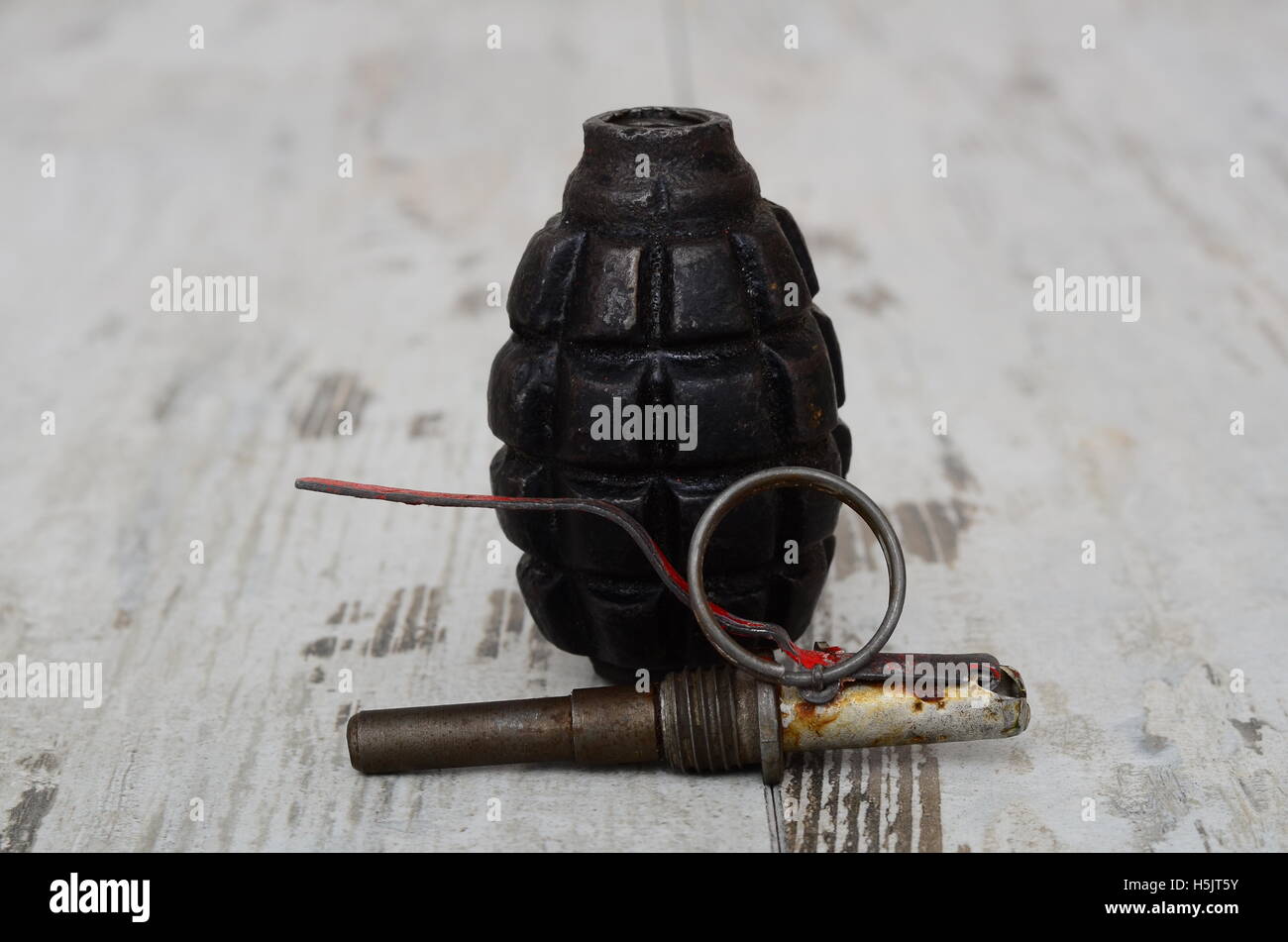 Old Hand Grenade on wood background. disguise, alarm Stock Photo - Alamy