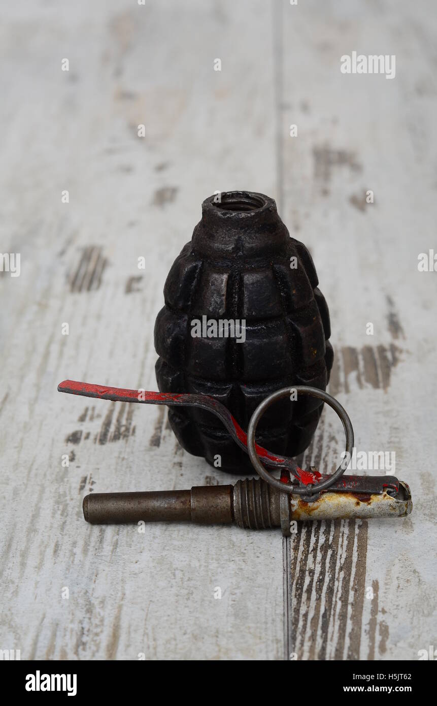 Old Hand Grenade on wood background. disguise, alarm Stock Photo - Alamy