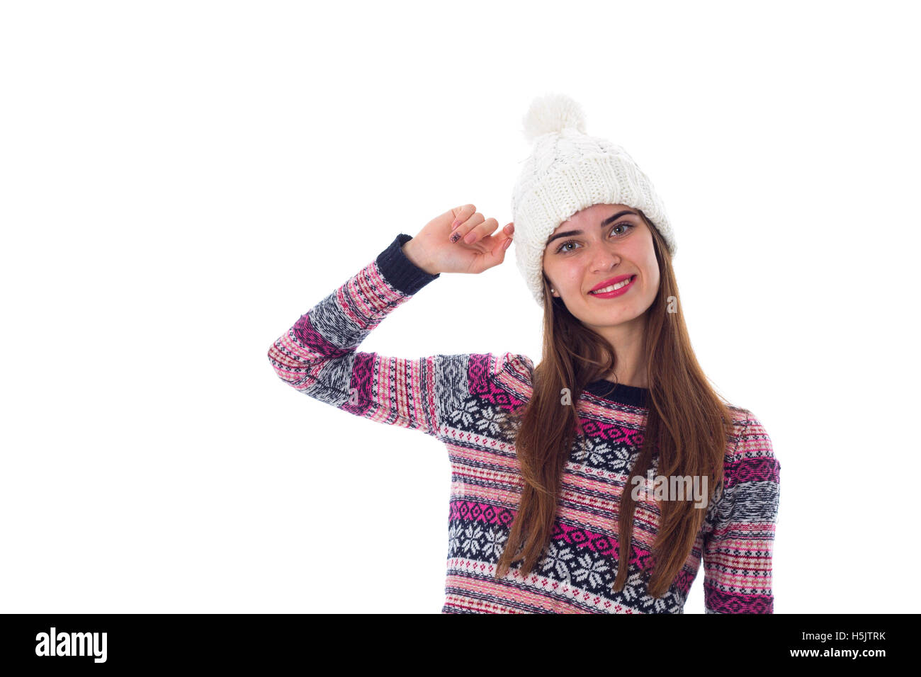Woman in sweater and white hat holding something Stock Photo - Alamy