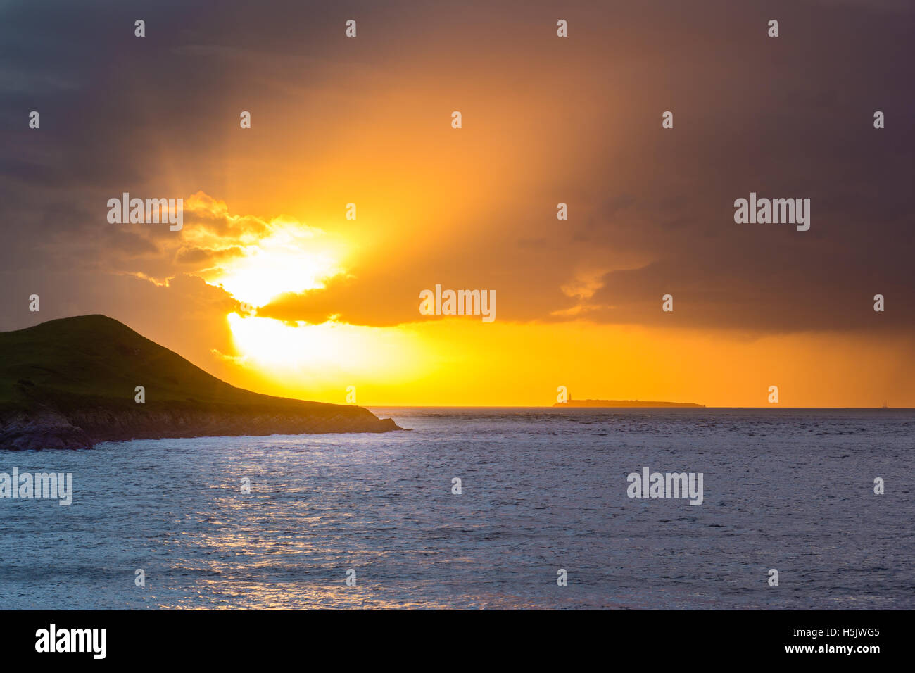 Sunset behind Flat Holm Island in the Bristol Channel. Spectacular sky ...