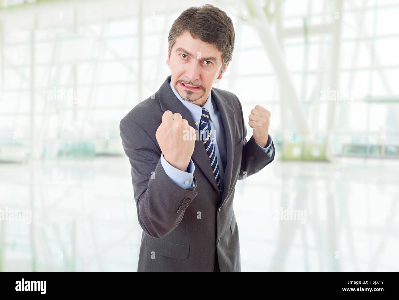 mad business man with open arms, at the office Stock Photo - Alamy