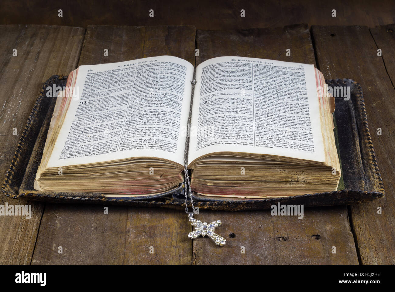 Old Holy Bible on rustic wood table with cross book mark Stock Photo ...