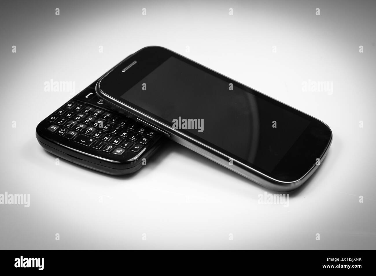 Two different phones, two different ages, black and white Stock Photo ...