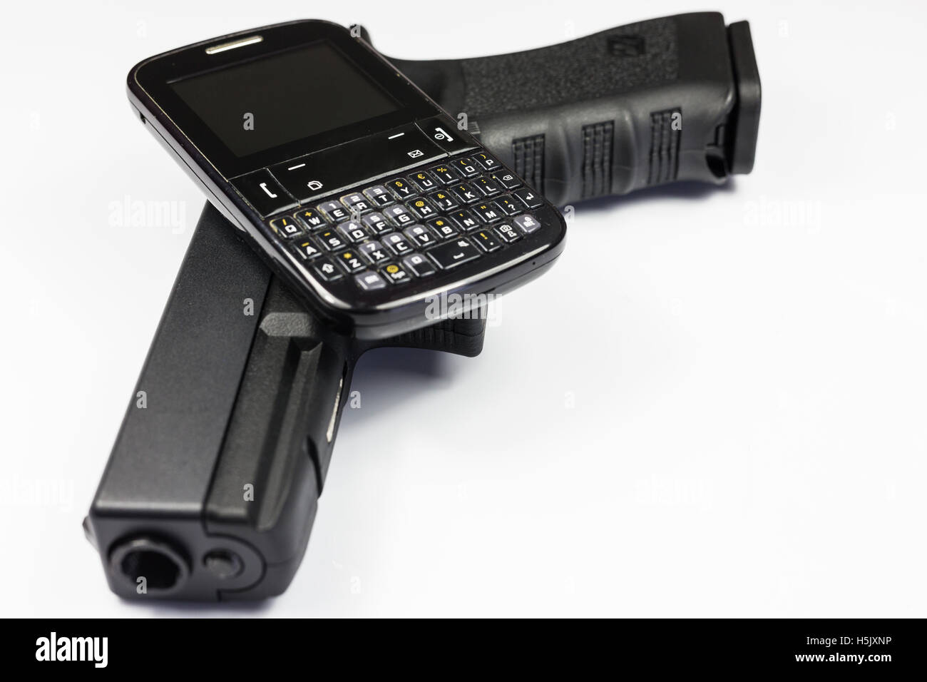 The gun and old phone Stock Photo - Alamy