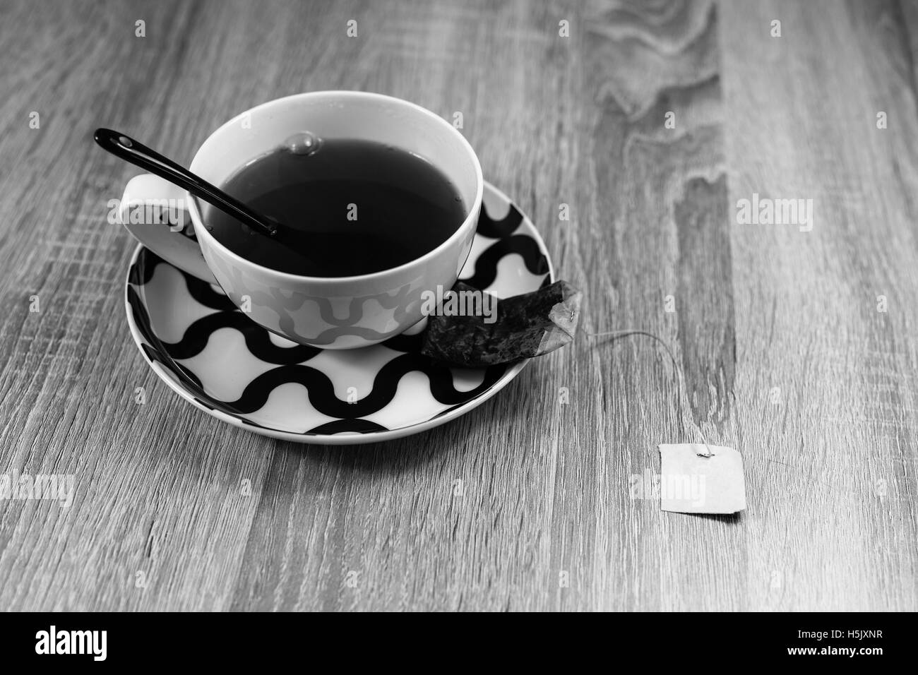 Breakfast tea with chinese spoon, black and white Stock Photo - Alamy