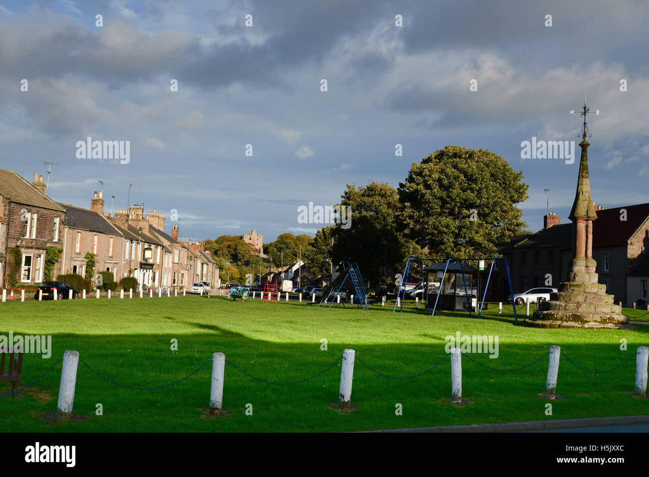 Norham village green, looking towards the Castle Stock Photo - Alamy