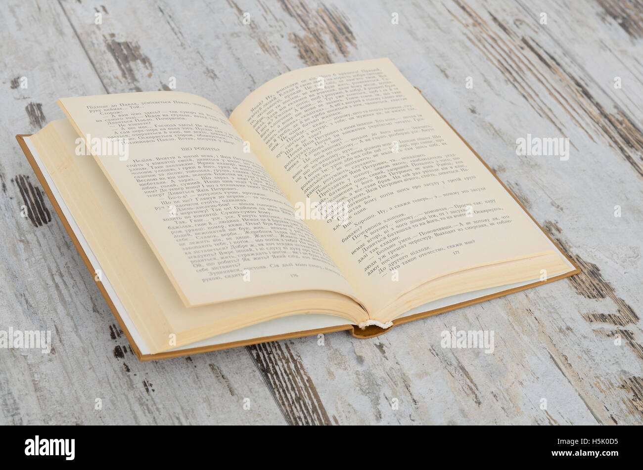 Vintage book, open, on old wooden table Stock Photo - Alamy