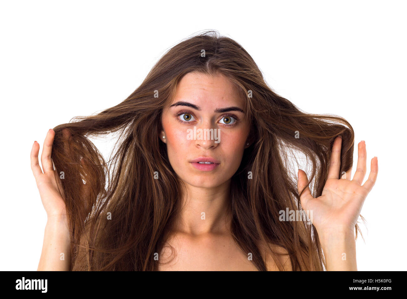 Woman touching her tangled hair Stock Photo - Alamy