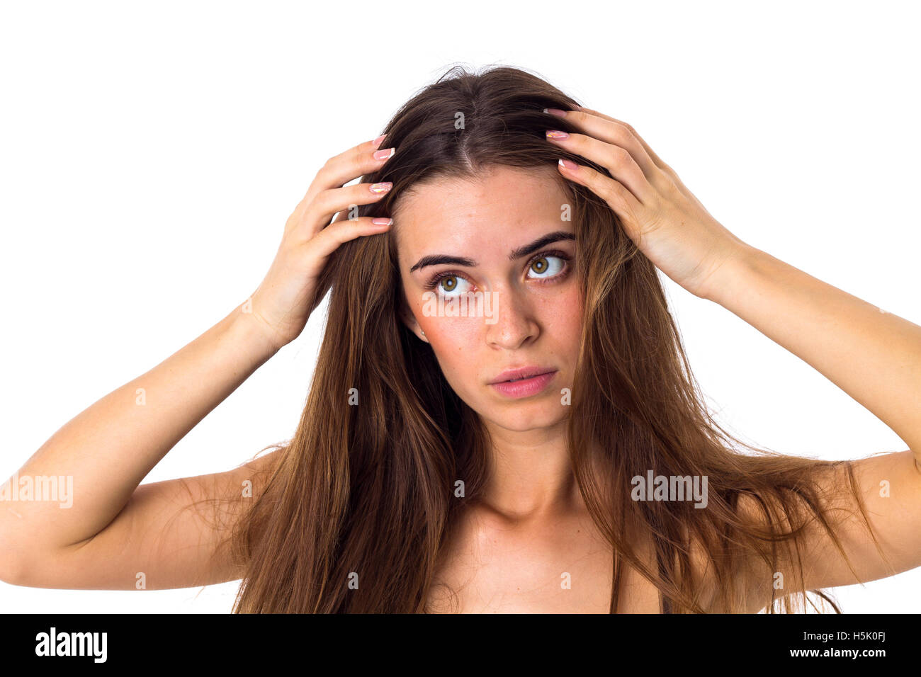 Woman touching her hair roots Stock Photo - Alamy