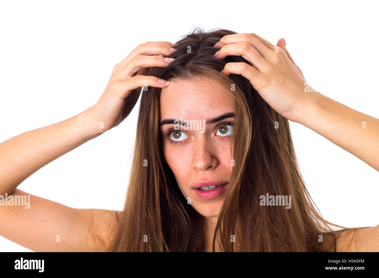 Woman touching her hair roots Stock Photo - Alamy