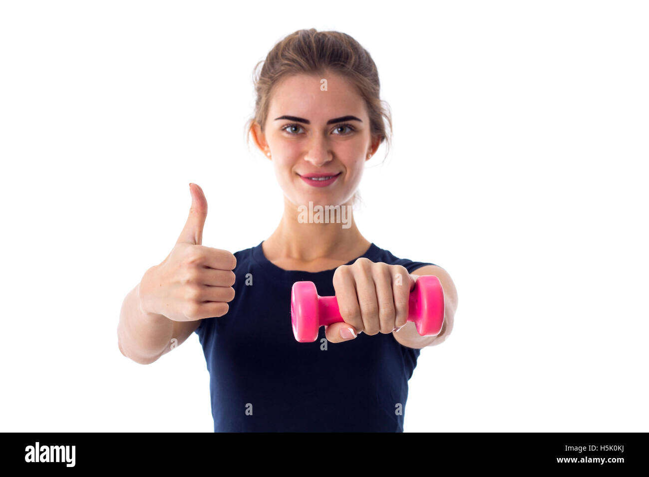 Woman holding dumbbell thumb hi-res stock photography and images - Alamy