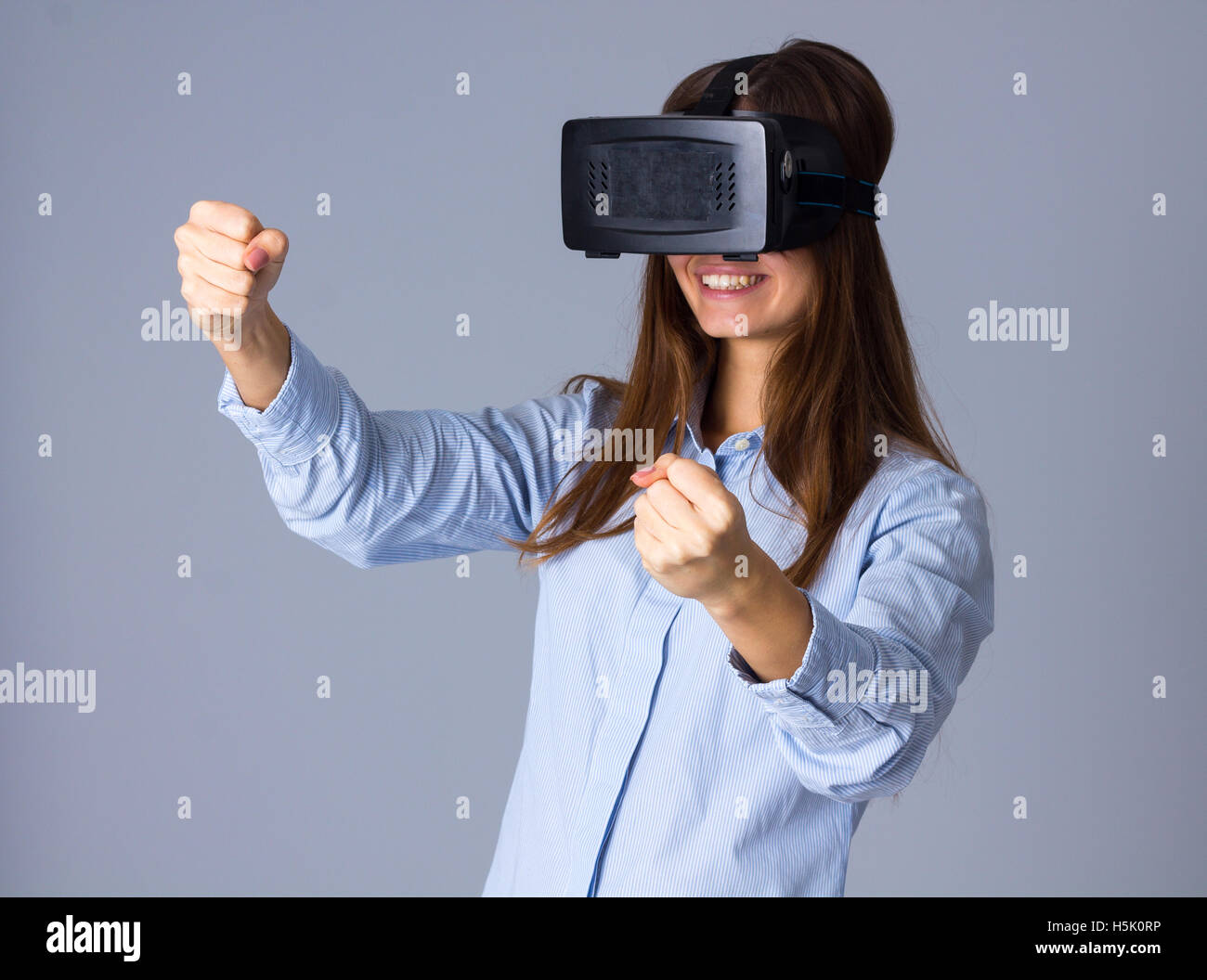 Woman using VR glasses Stock Photo - Alamy