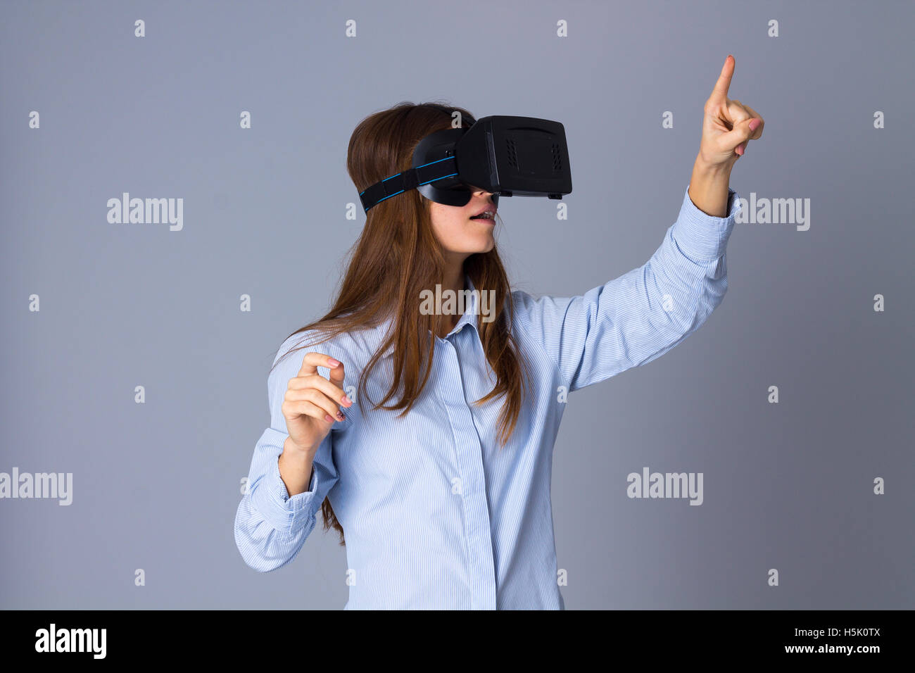 Woman using VR glasses Stock Photo - Alamy