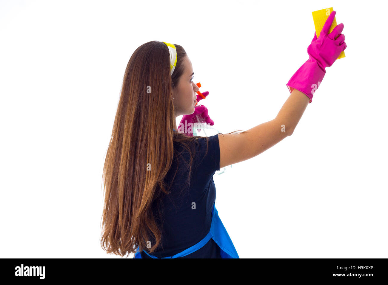 Woman using detergent and duster Stock Photo - Alamy