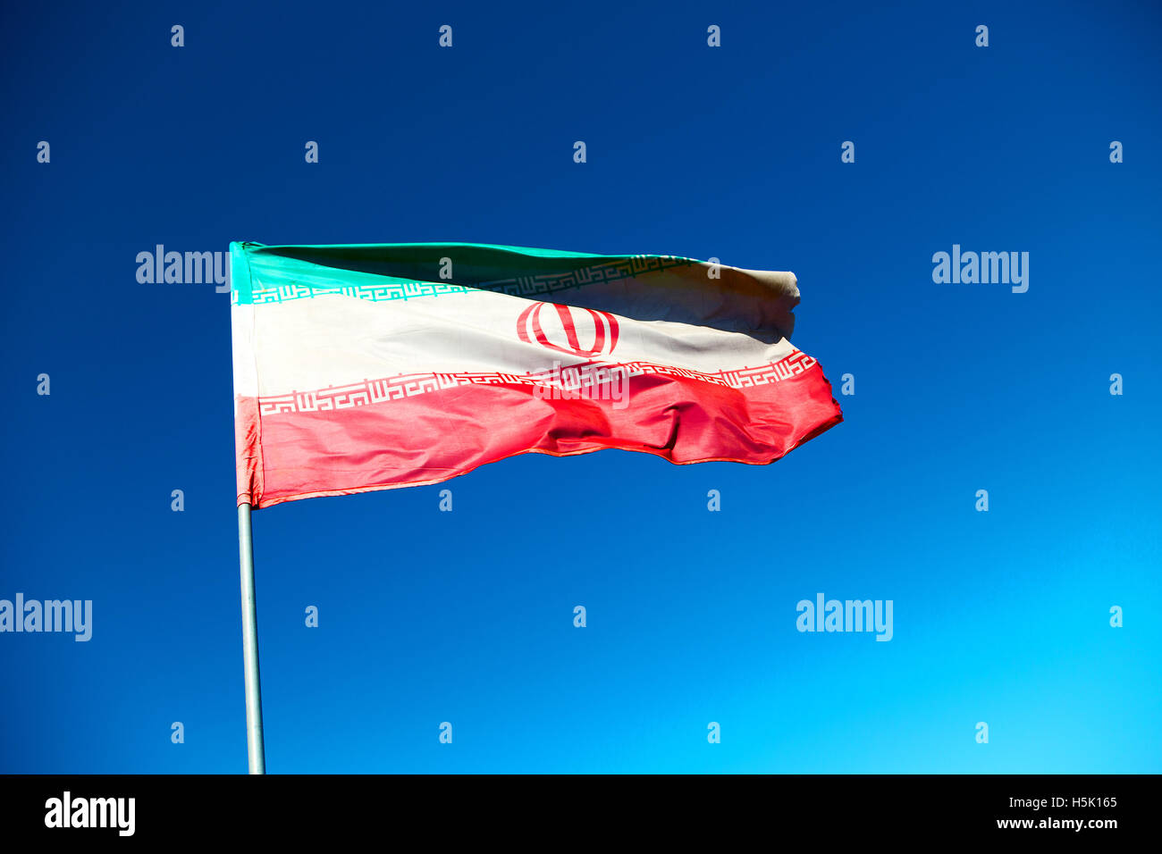 in iran blur iranian waving flag the blue sky and wind Stock Photo - Alamy
