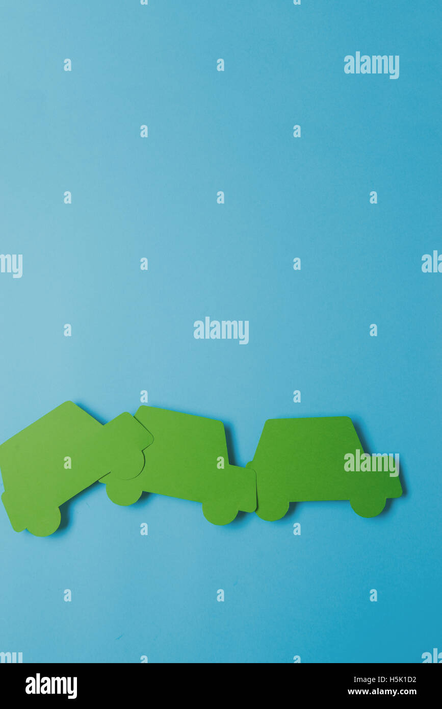 paper green cars figure. top view on blue background Stock Photo - Alamy