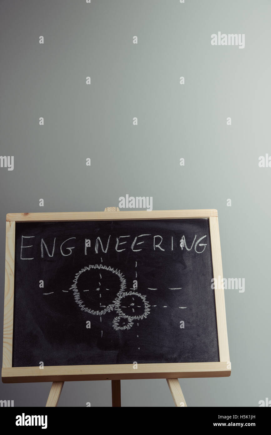 Engineering word handwritten on chalkboard. Gray background Stock Photo ...