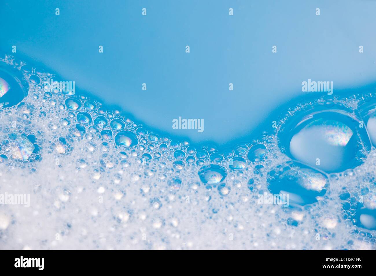Abstract background of soap foam, suds, shower. Blue background. soft ...
