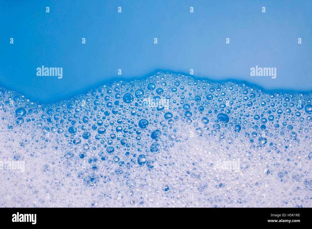 Abstract background of soap foam, suds, shower. Blue background. soft ...