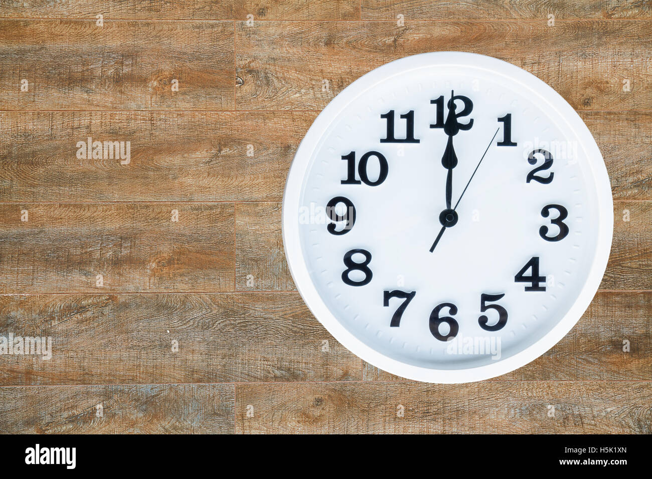 Clock show 12 am or pm on wood background with copy space. clipping ...