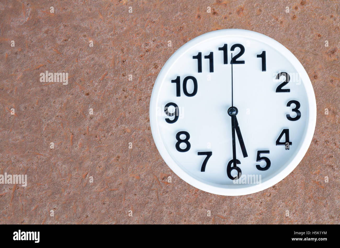 Clock show 5 am or pm and 30 minute on steel rusty background with copy ...