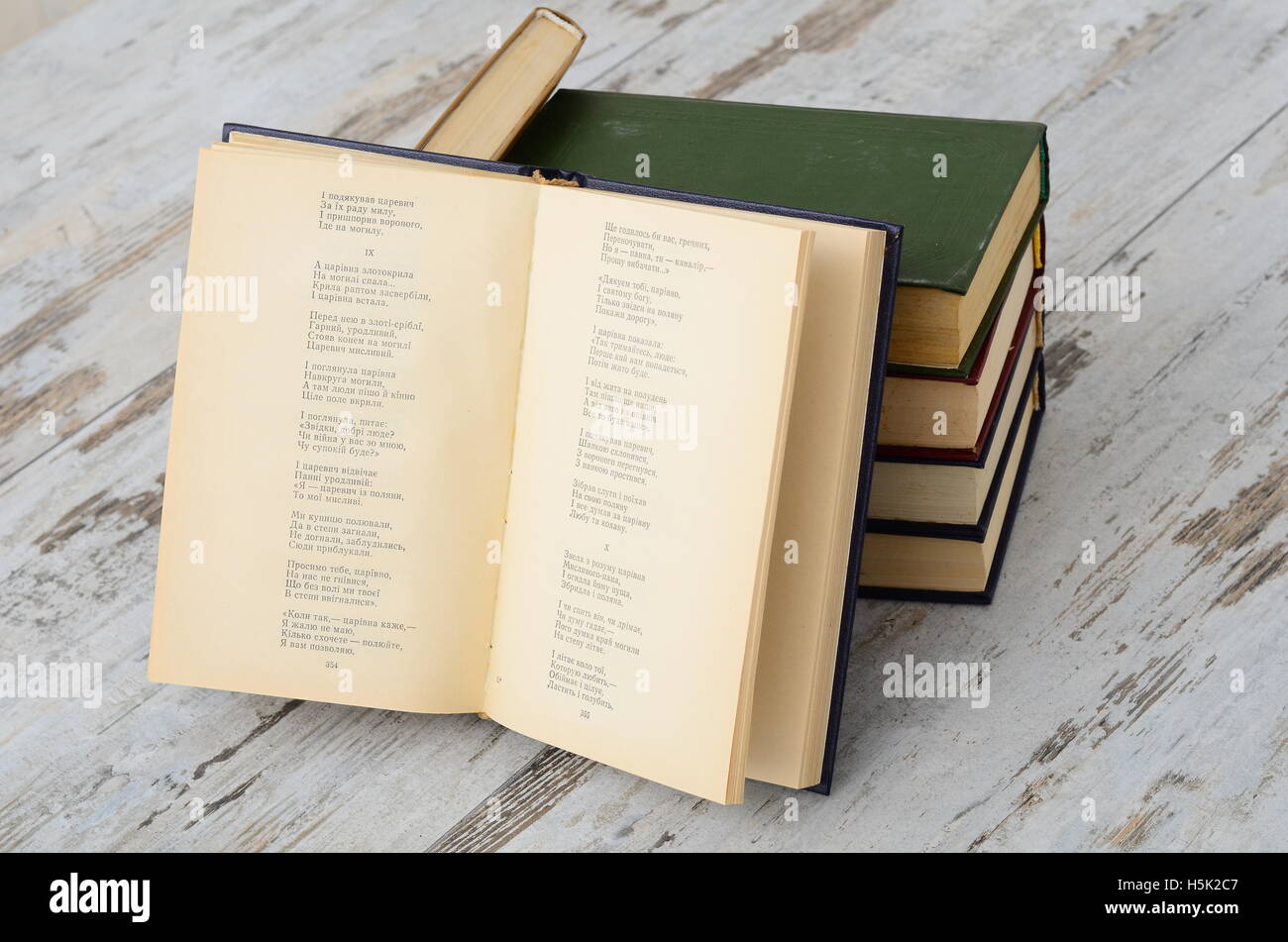 Vintage book, open, on old wooden table Stock Photo - Alamy