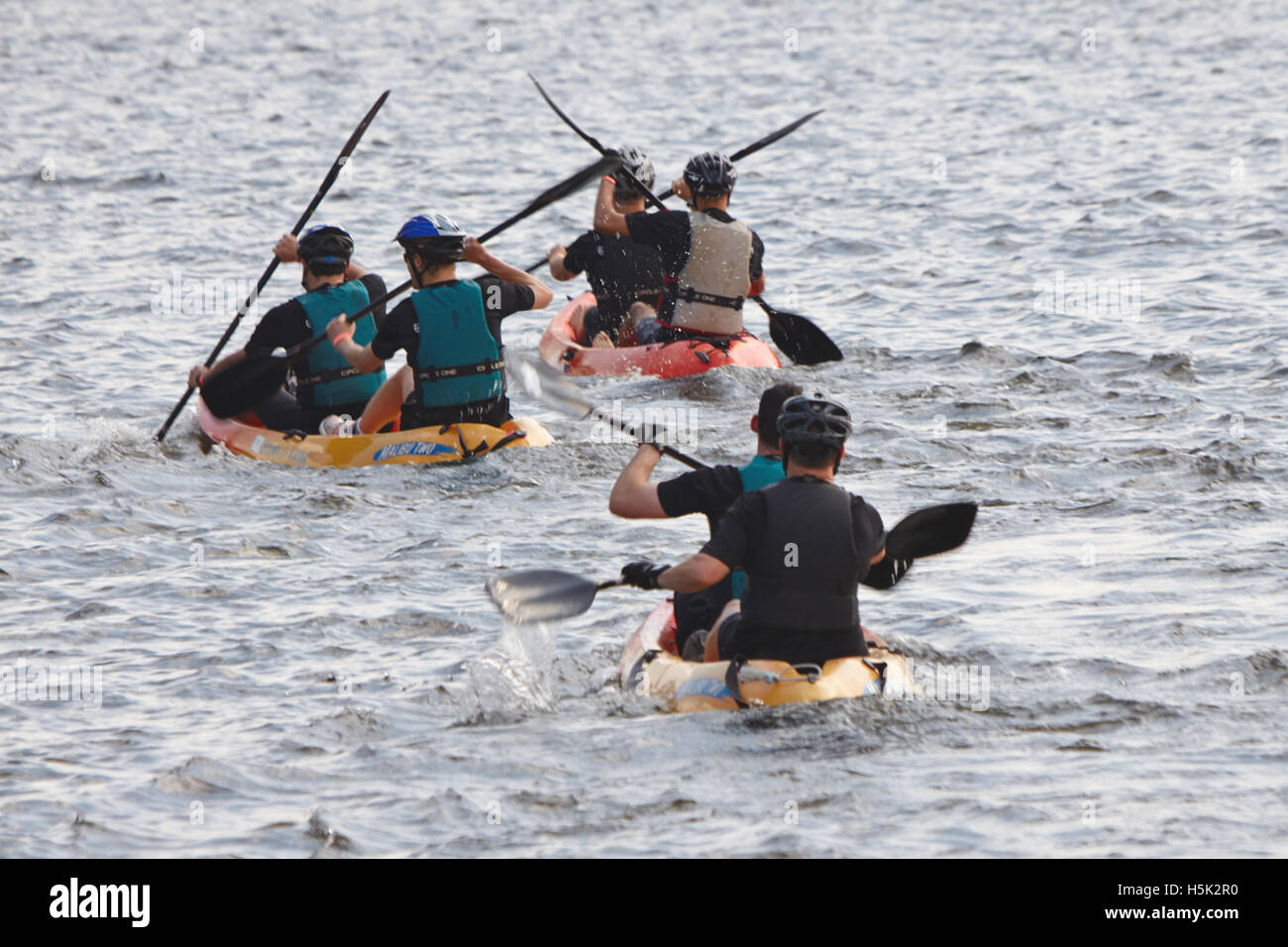 Competitors in the Rat Race Urban Adventure take part in a kayak ...