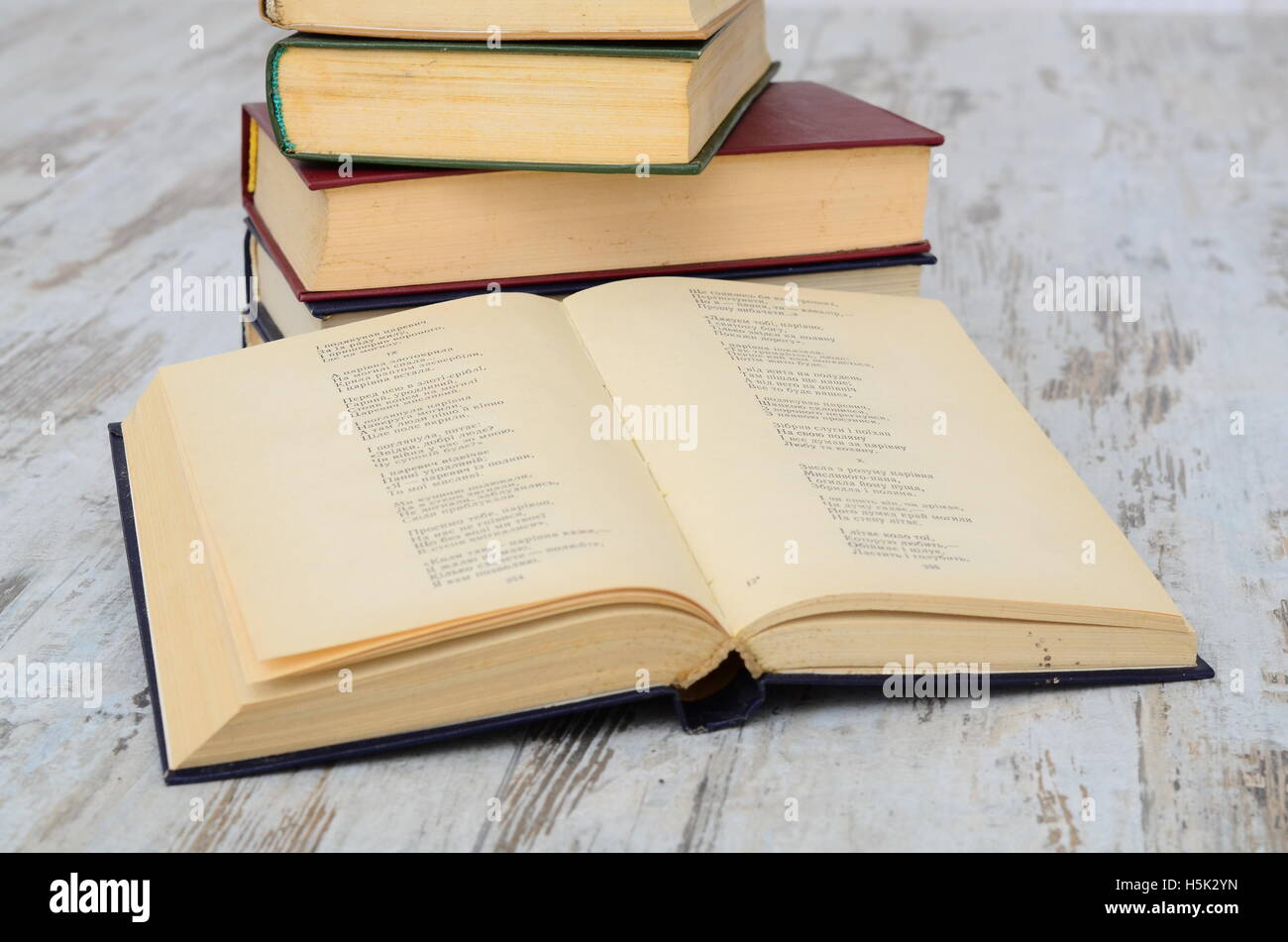 Vintage book, open, on old wooden table Stock Photo - Alamy