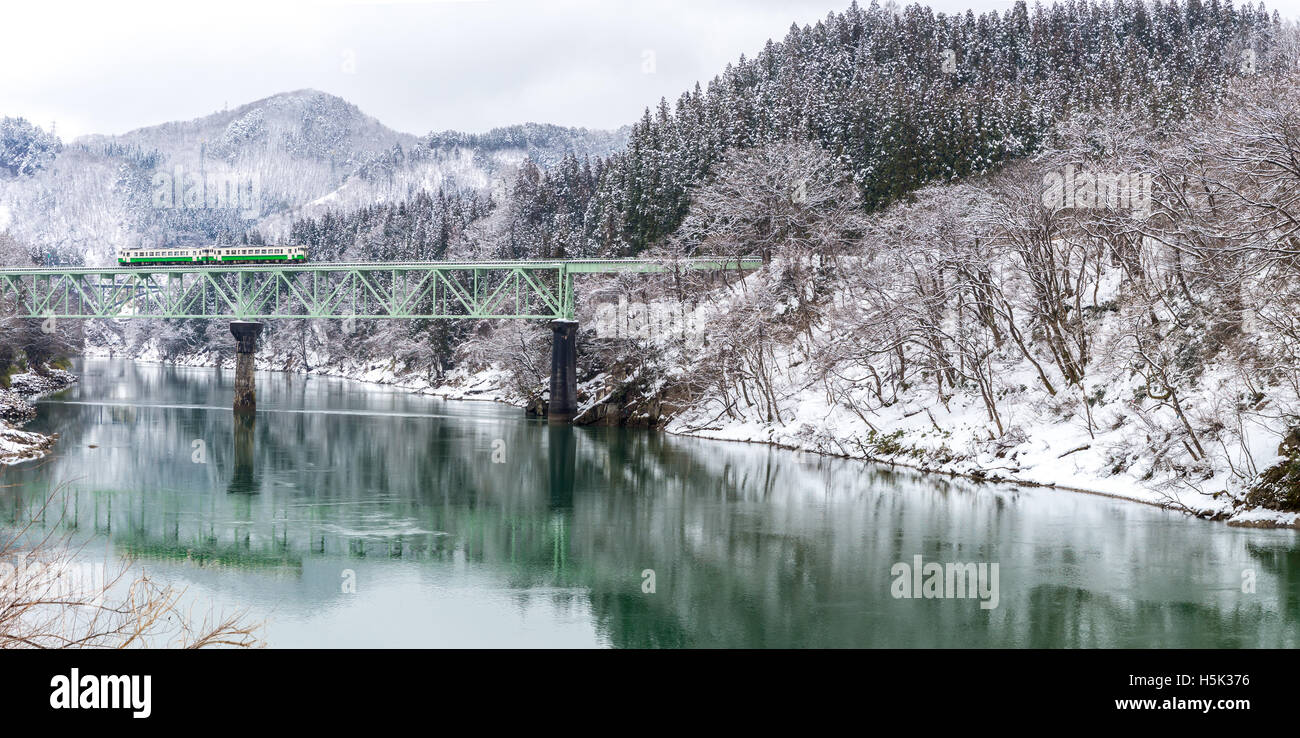 Train in Winter landscape snow on bridge panorama Stock Photo - Alamy