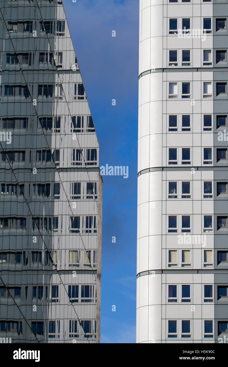 A high rise skyscraper reflected in the glass fronted windows of ...