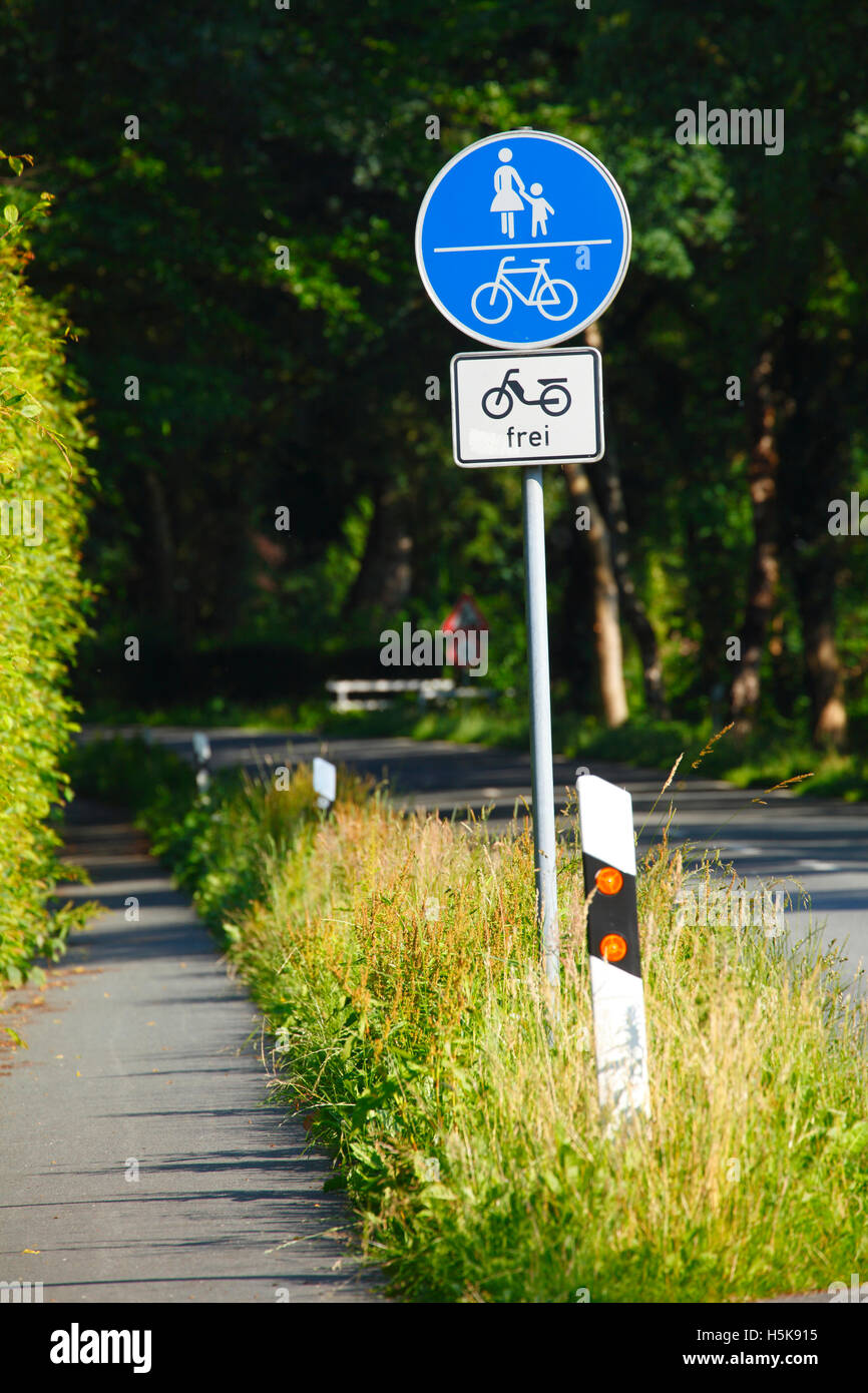 Road sign shared footpath and cycle track, guardrail beside Highway ...