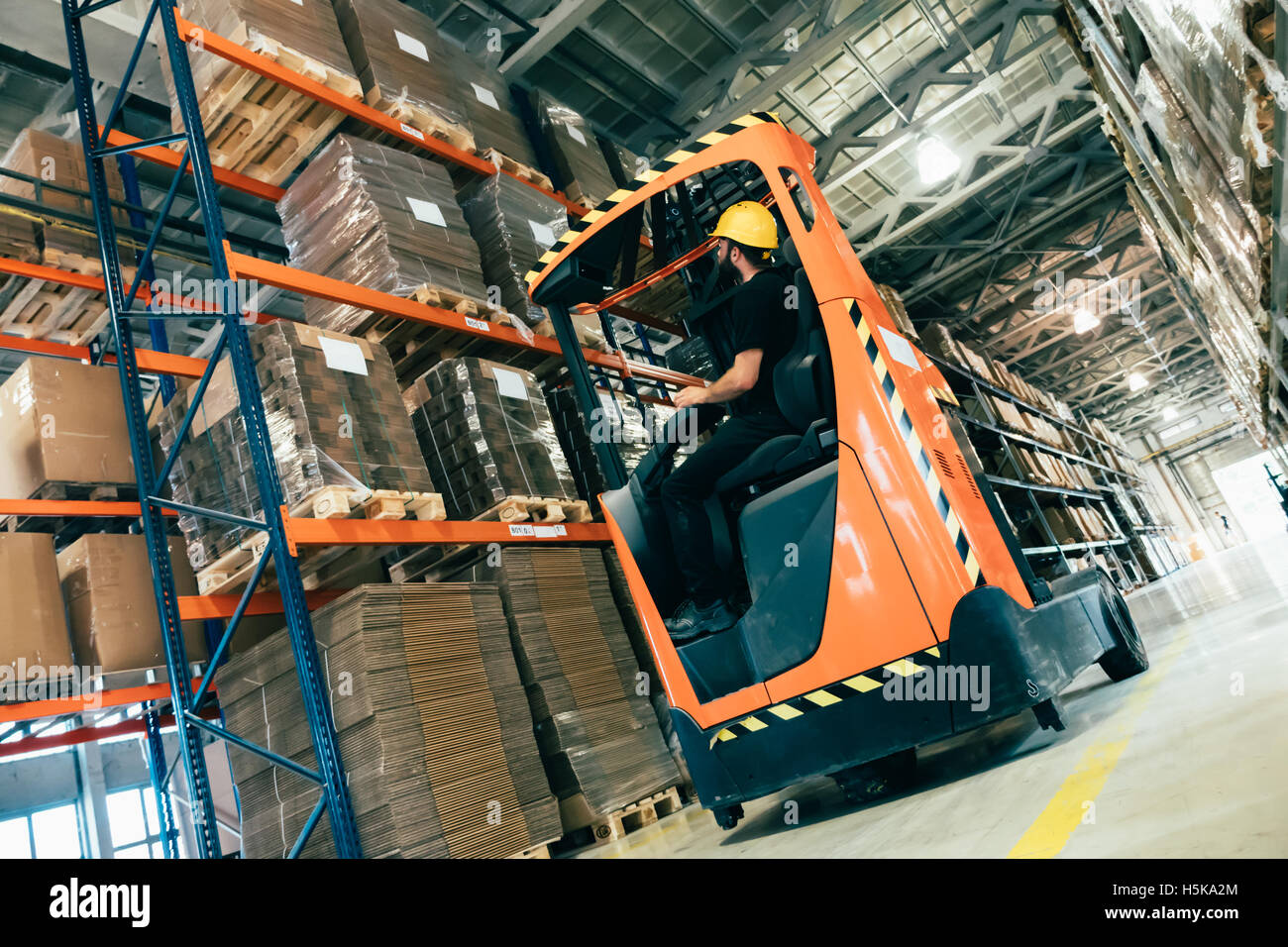 Worker helmet driving forklift hi-res stock photography and images - Alamy