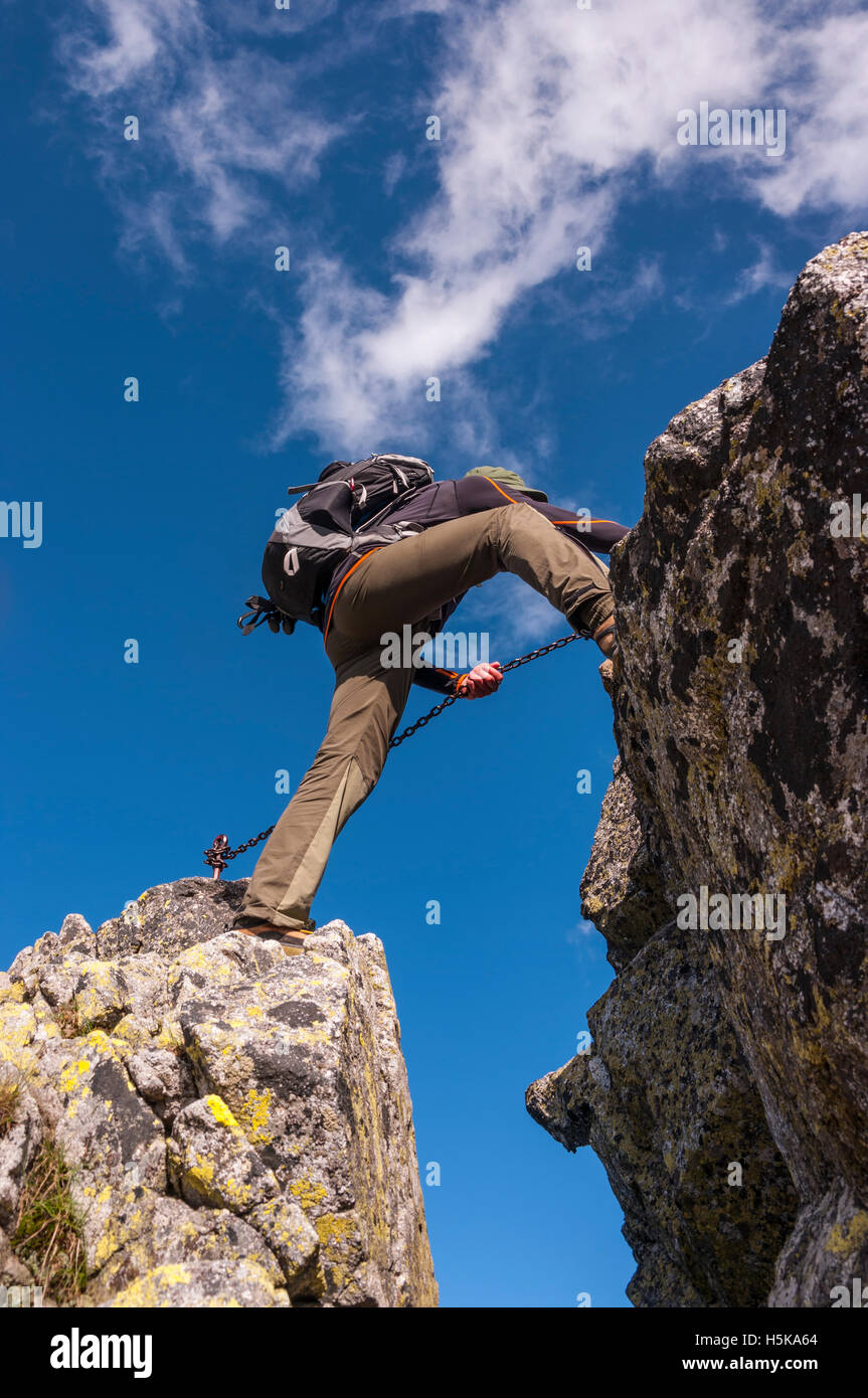 Hiker on a mountain trail Stock Photo - Alamy