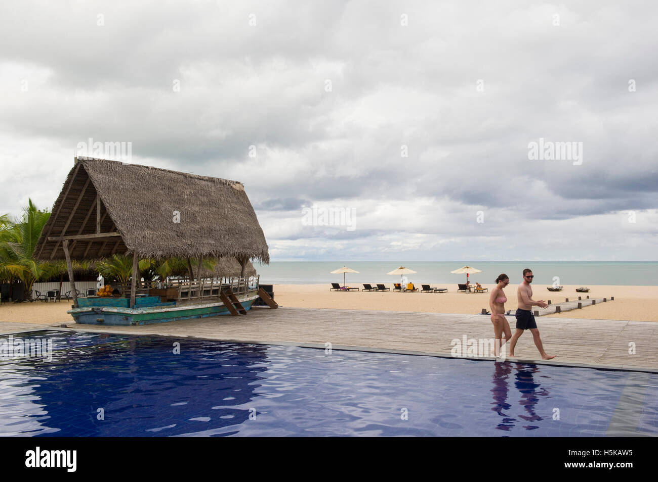 Resort swimming pool in front of a sandy beach in Passikudah Bay, Sri ...