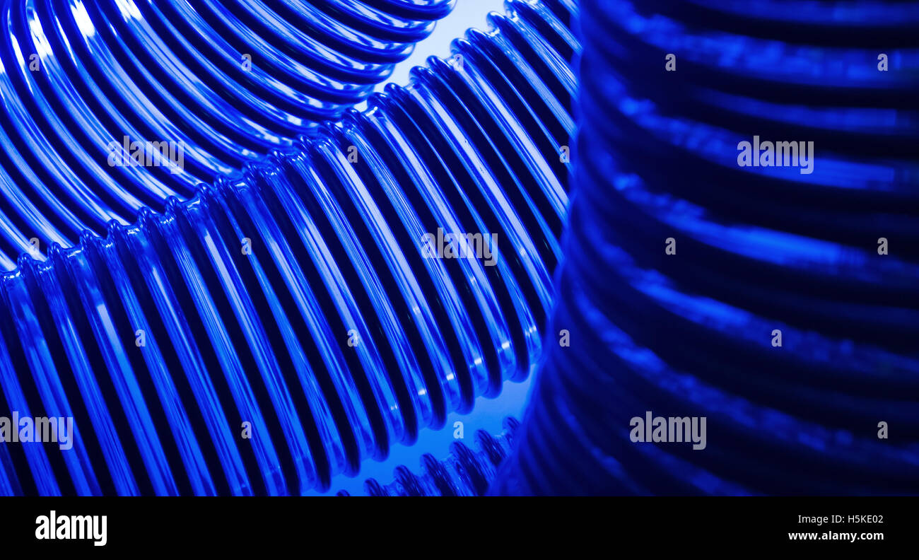 Long flexible blue vacuum tube Stock Photo - Alamy