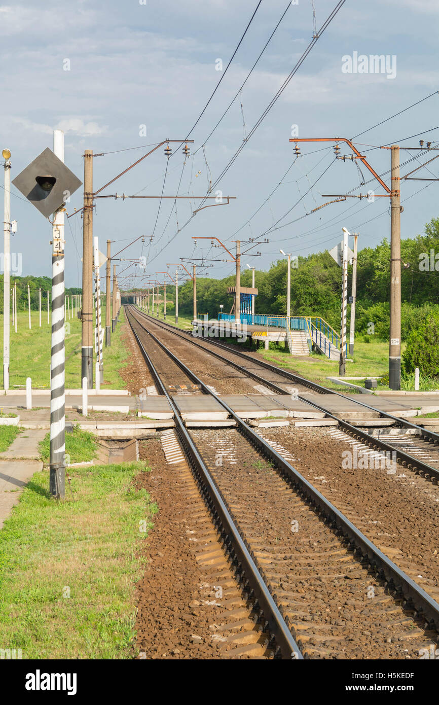 Railroad station, railroad tracks and a platform for trains Stock Photo ...